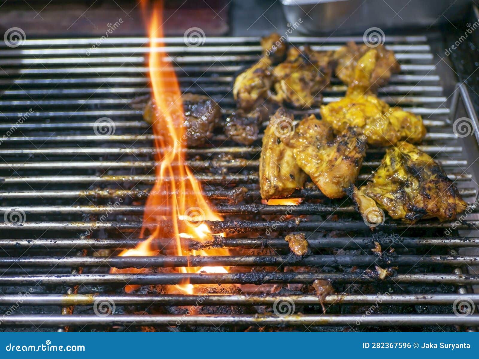 Grilled Chicken with a Burning Fire on the Grill Stock Photo - Image of ...