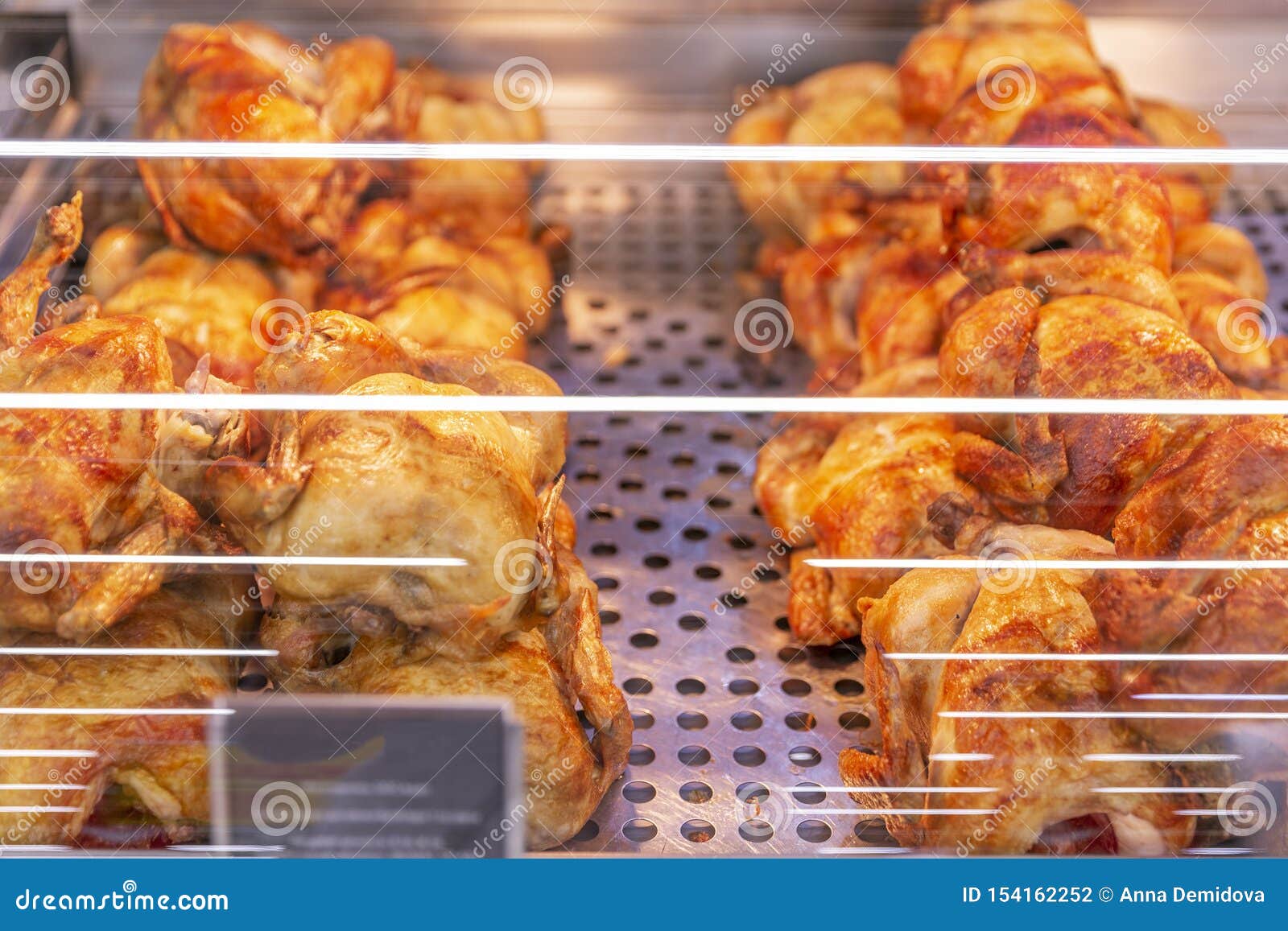 Grilled Chicken on the Storefront in the Store. Close-up Stock Photo ...