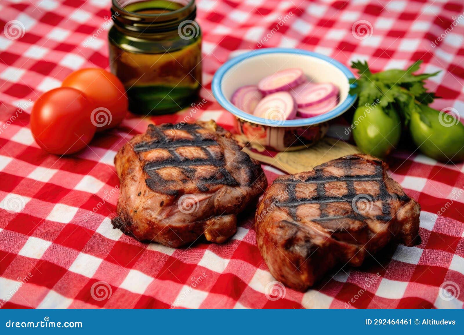 Grilled Chops on Red Checkered Picnic Cloth with Pickles and Bread ...