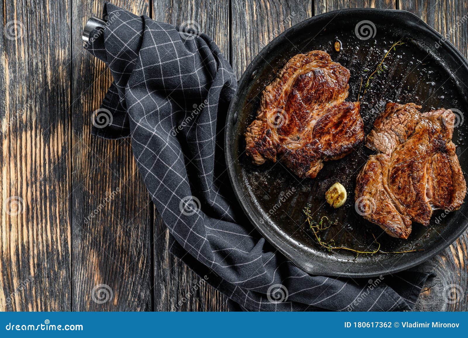 Grilled Chuck Eye Roll Steak in a Pan. Dark Background. Top View Stock ...