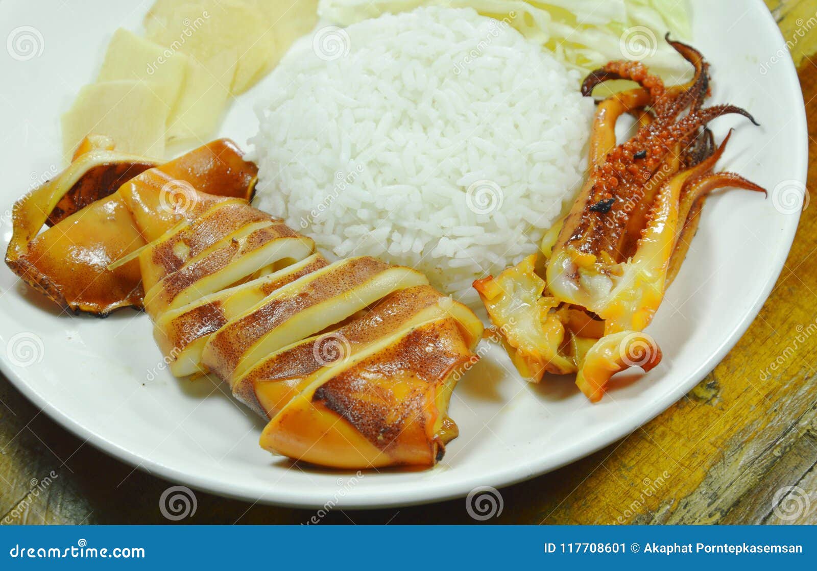 Grilled Cuttlefish with Rice Topping Slice Cabbage and Ginger on Plate ...