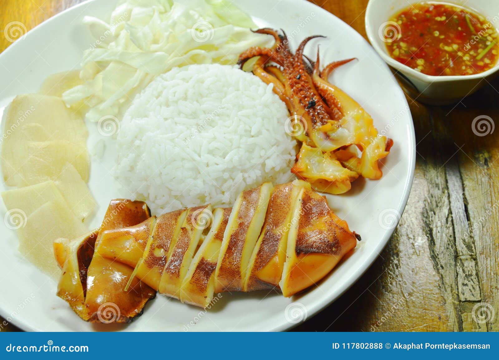 Grilled Cuttlefish with Rice Topping Slice Cabbage and Ginger on Plate ...