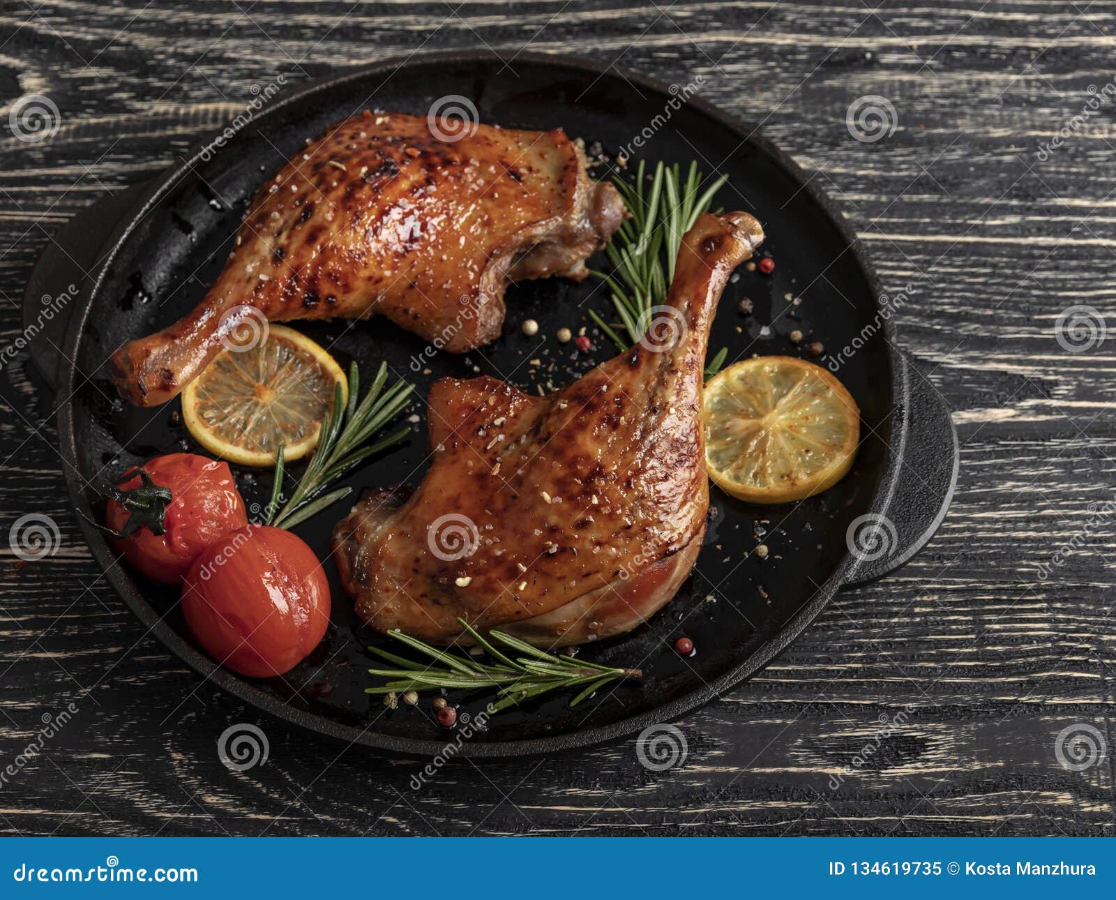 Grilled Duck Legs with Tomato and Lemon in a Pan Stock Image - Image of ...