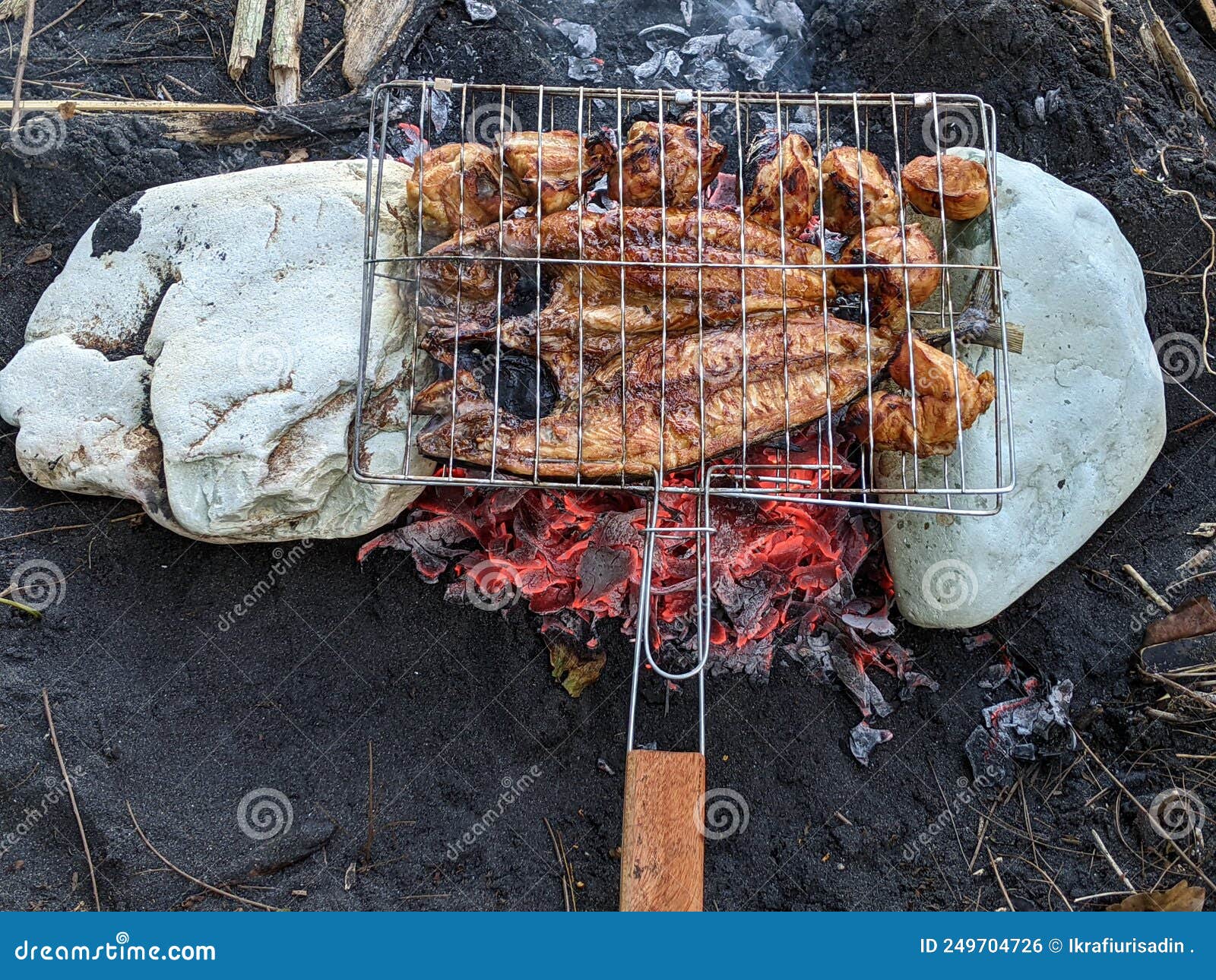 Grilled fish on the beach stock photo. Image of lunch - 249704726