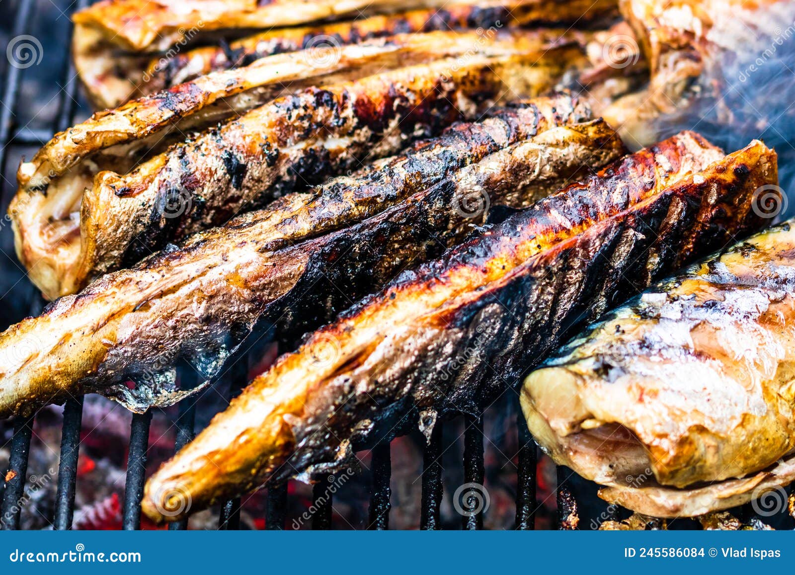 Grilled Fish on Charcoal Grill. Fresh Fish Barbecue Stock Photo - Image ...