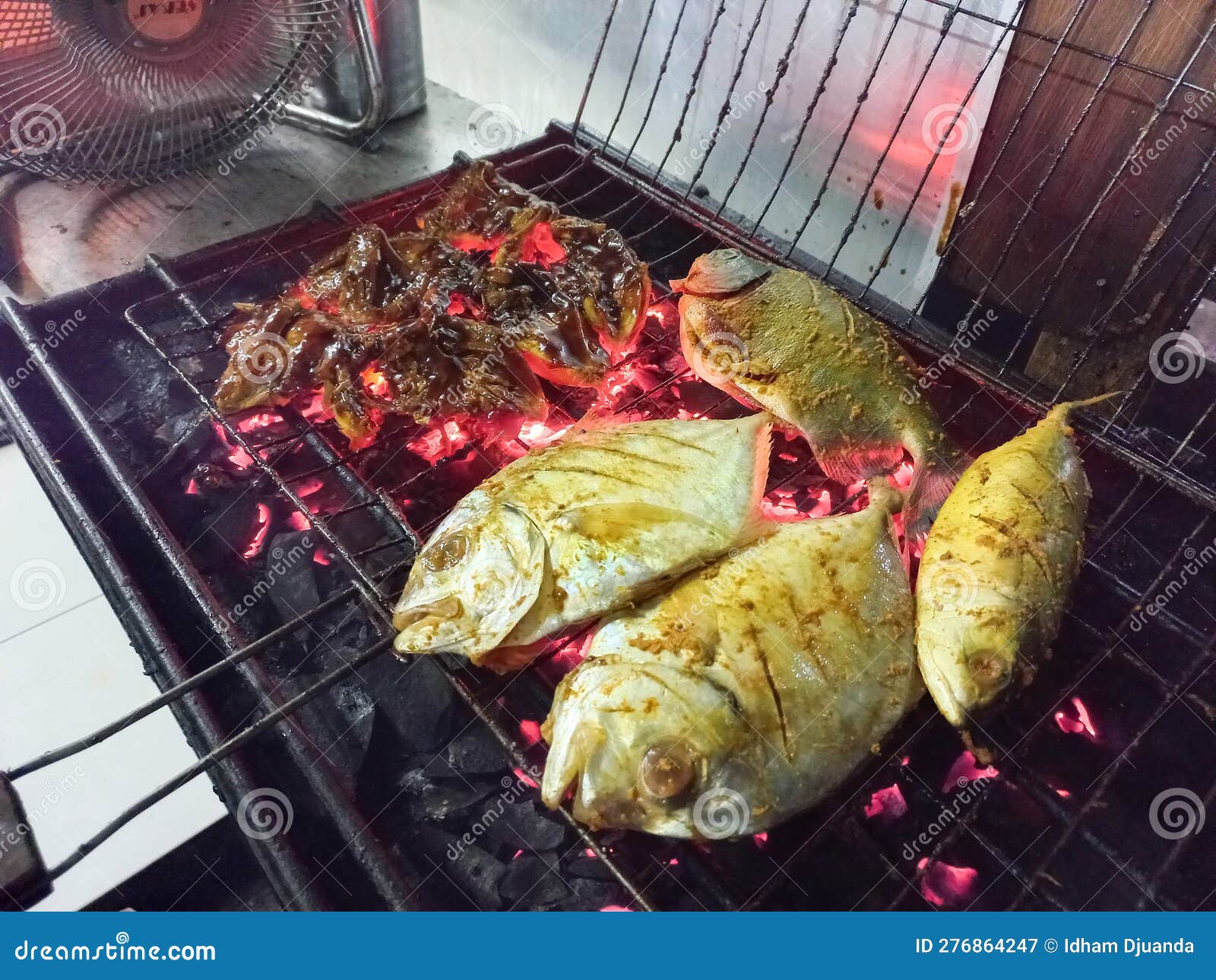 Grilled Fish that is almost Cooked is Being Grilled in the Fireplace ...