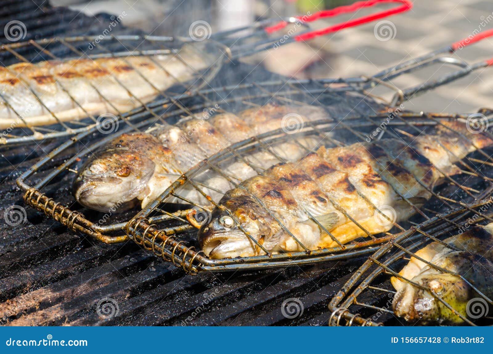 Grilled Fish on Fire. Barbecue Stock Photo - Image of meal, dinner ...