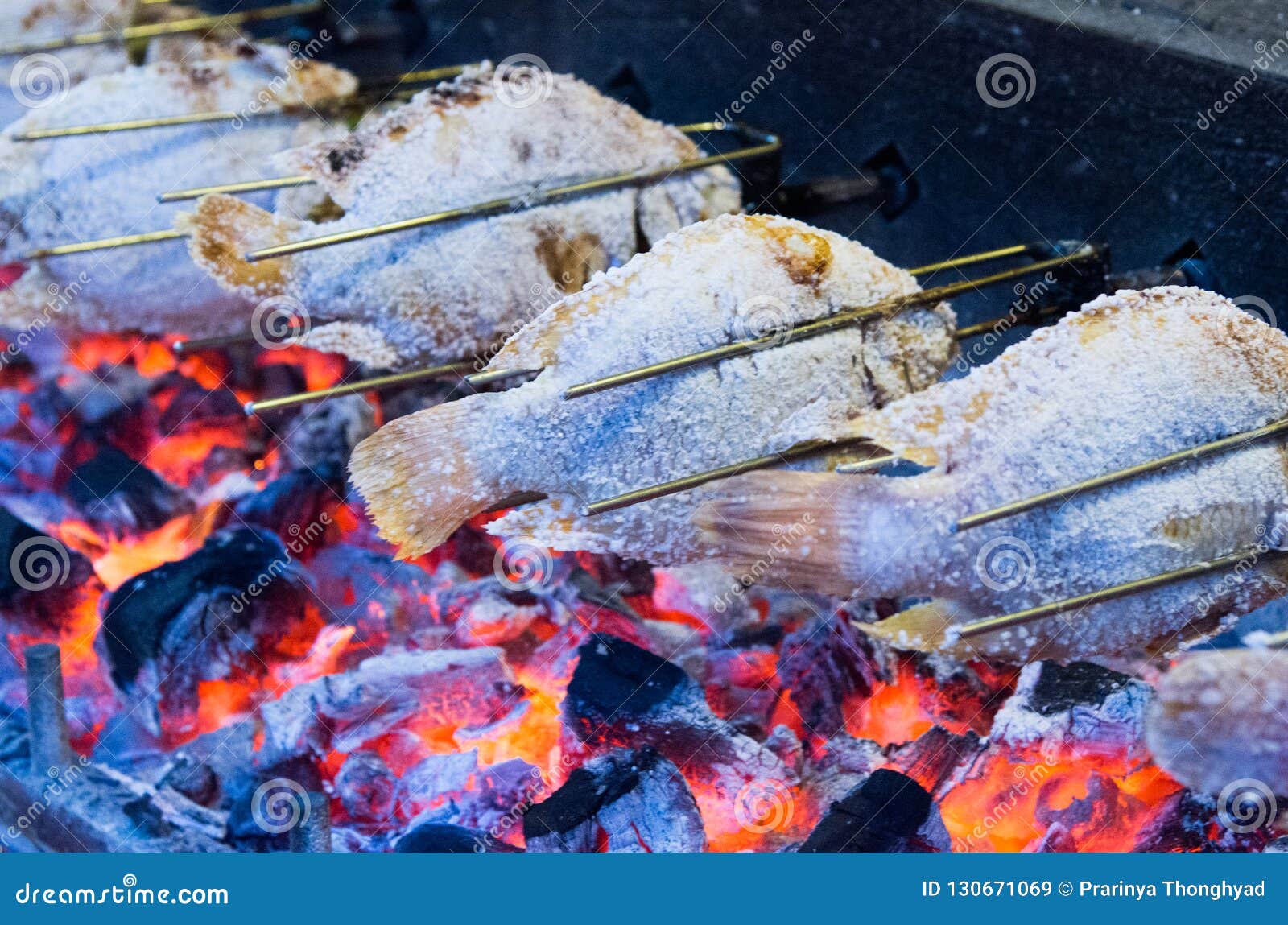 Grilled fish with flames stock image. Image of grill - 130671069
