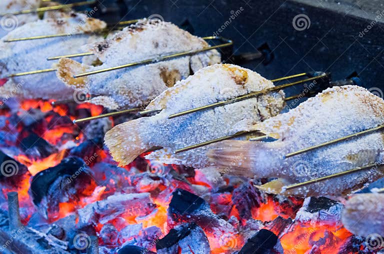 Grilled fish with flames stock image. Image of grill - 130671069