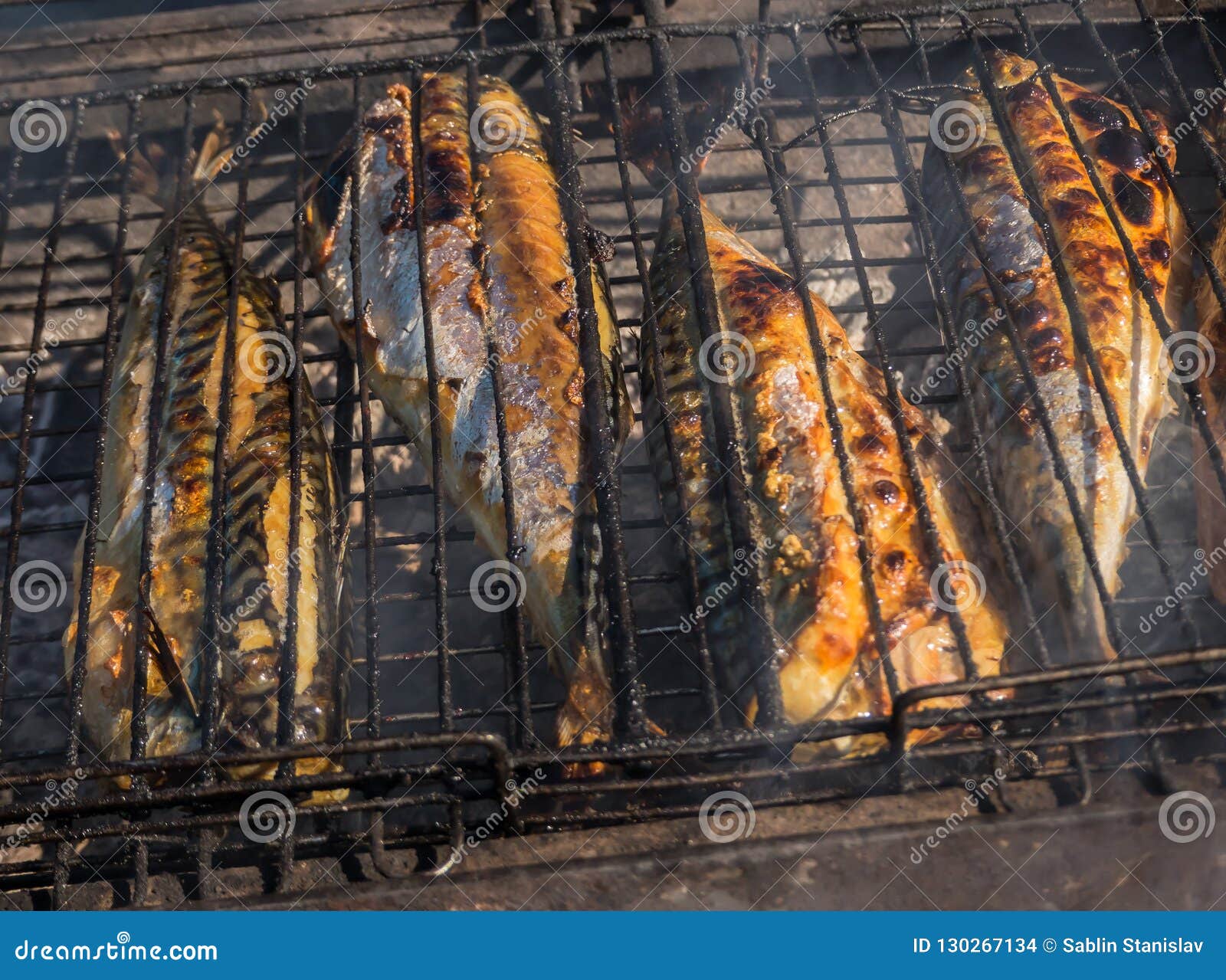 Grilled Fish Fried in Smoke. Barbecue Concept. Stock Photo - Image of ...