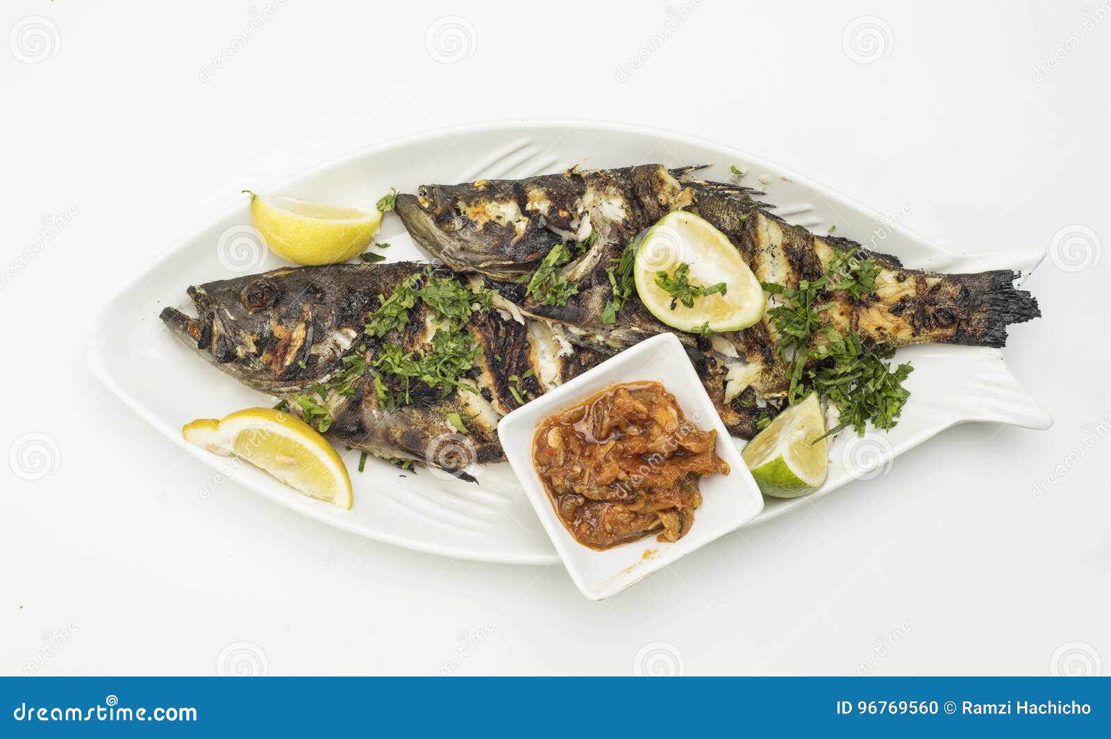 Grilled Fish With Lemon Slices, Grilled Seafood Served On Plate ... Grilled Fish With Lemon Slices, Grilled Seafood Served On Plate ...