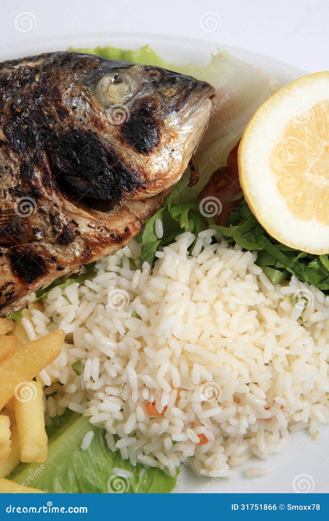 Grilled fish on a plate stock photo. Image of recipe - 31751866