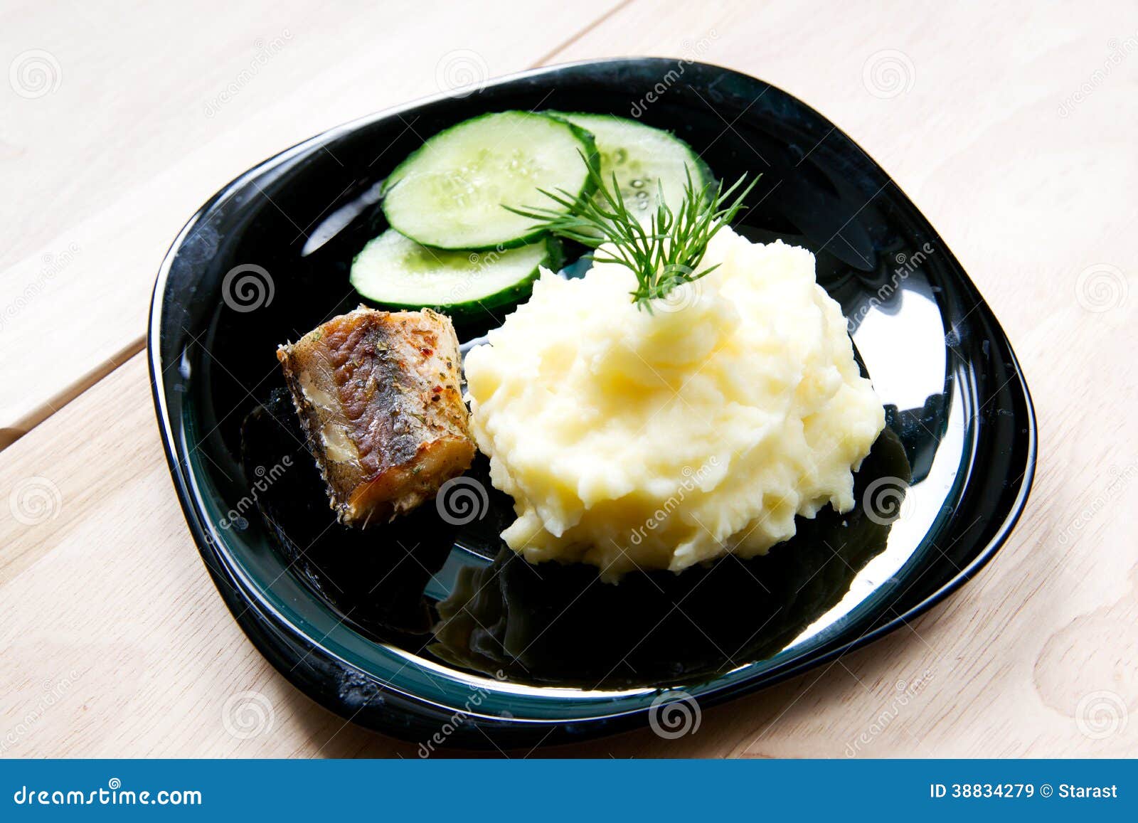 Grilled fish with potatoes stock image. Image of dish - 38834279
