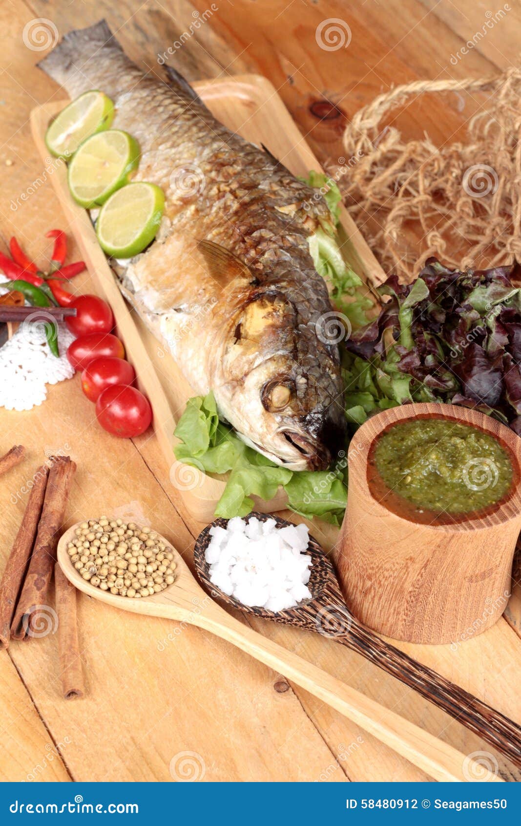 Grilled Fish of Salt with Spicy Sauce Delicious. Stock Photo - Image of ...