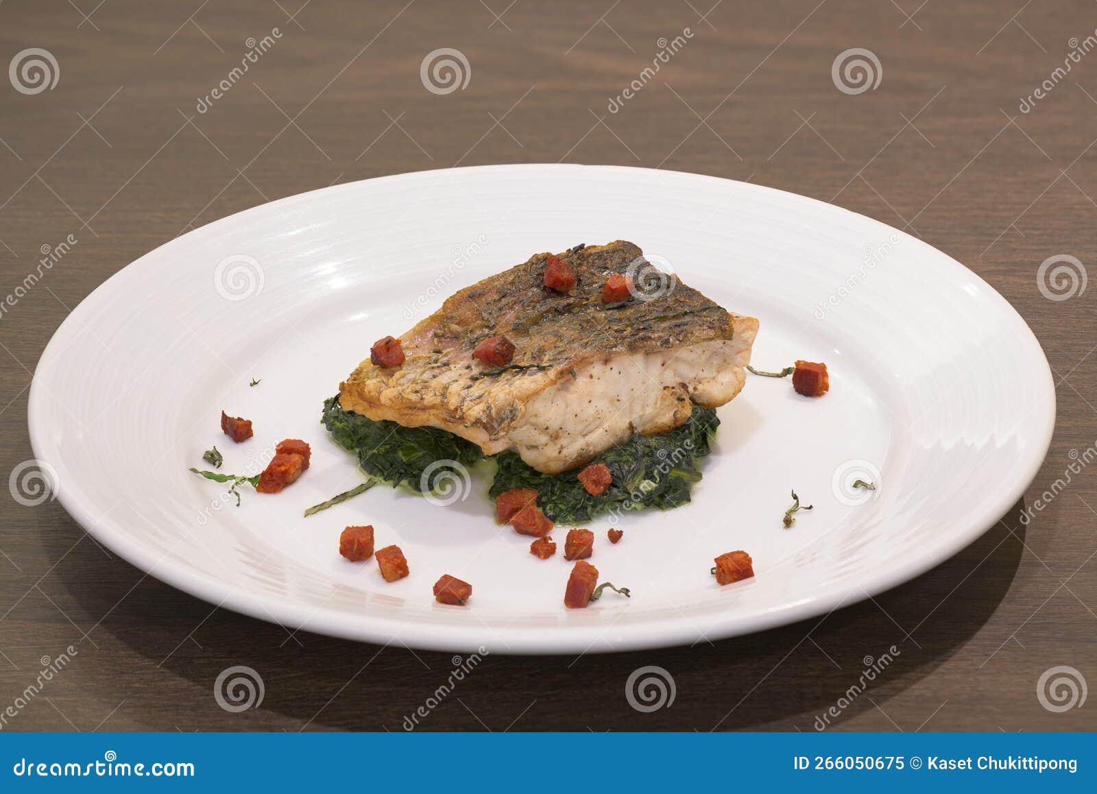 Grilled fish and spinach stock image. Image of juicy - 266050675