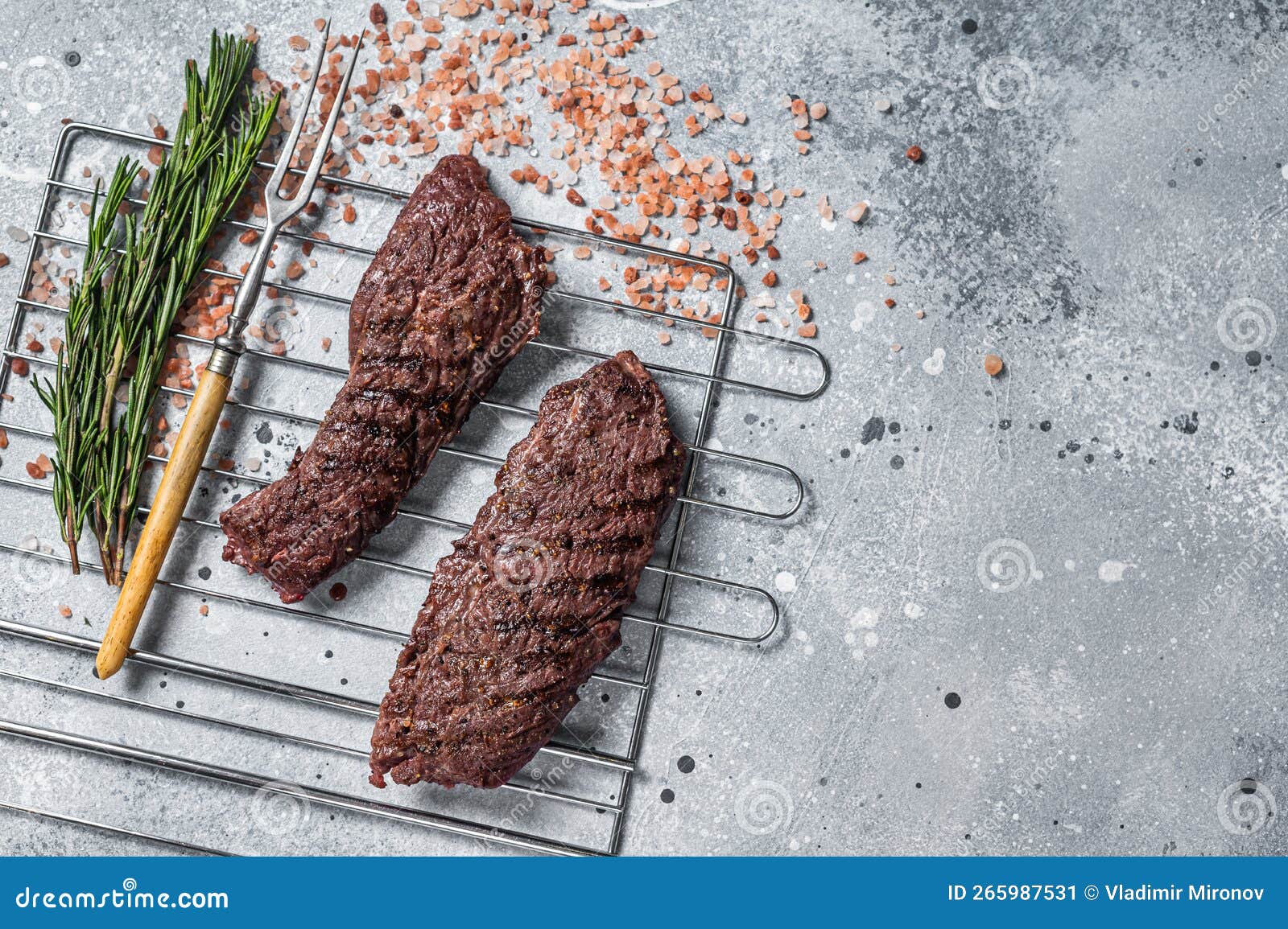 Grilled Flap Steak Flank Cut And Machete Skirt Steak On Grill With Herbs Gray Background Top