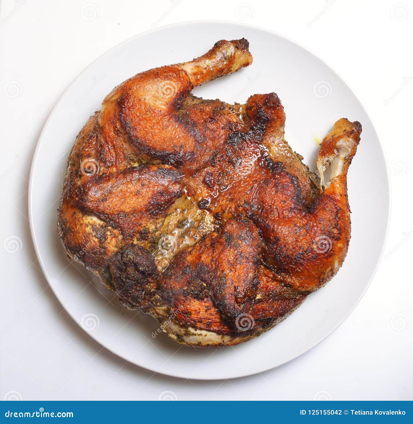 Grilled Fried Roast Chicken Tabaka on White Plate Stock Photo - Image ...