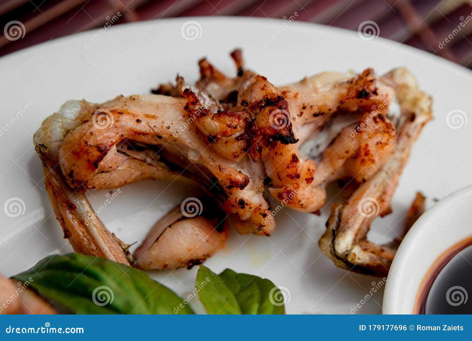 Grilled Frog Legs on the White Plate Stock Photo - Image of frog ...
