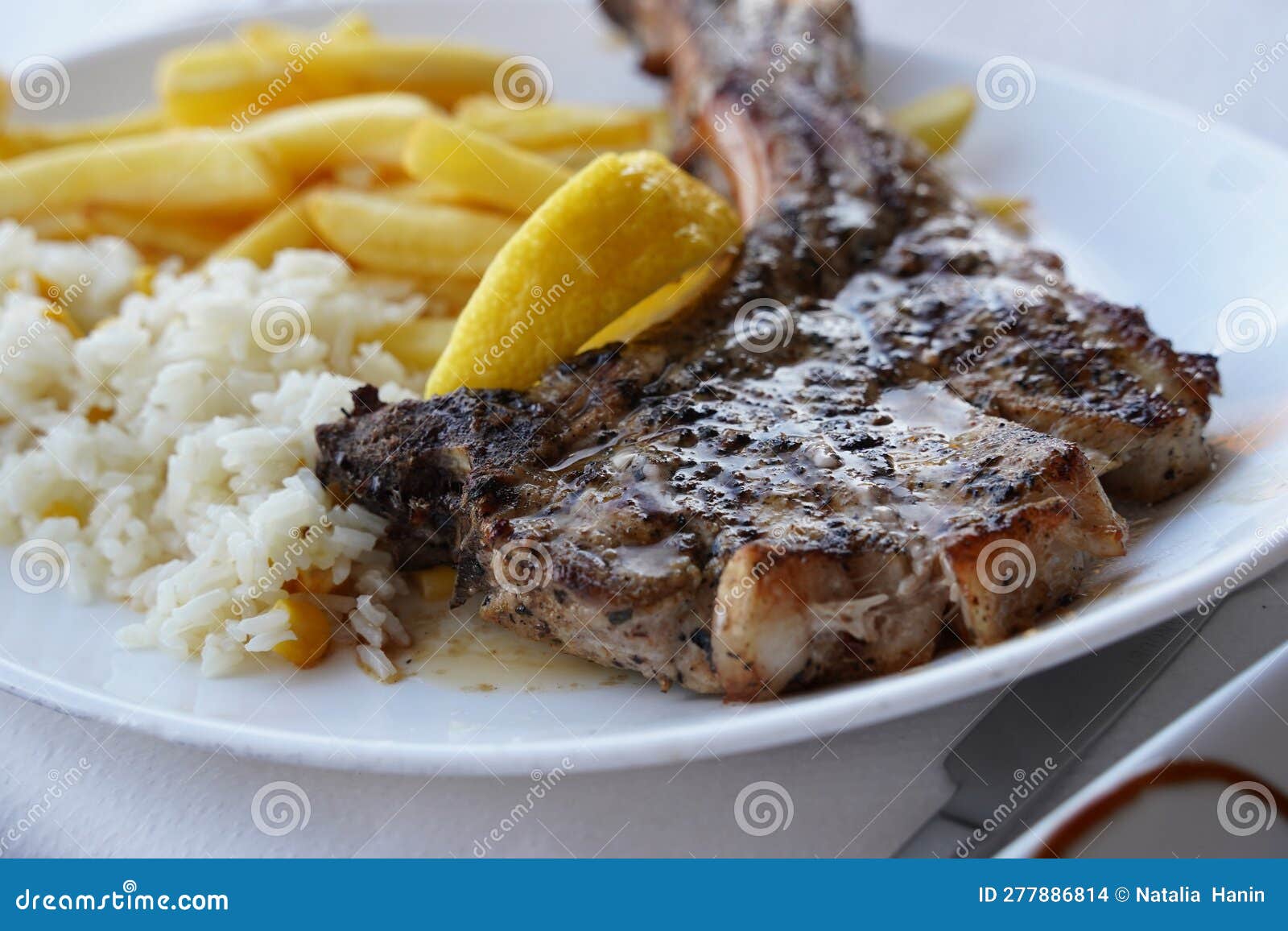 Grilled Giant Pork Chop with Chips and Salad Stock Photo - Image of ...