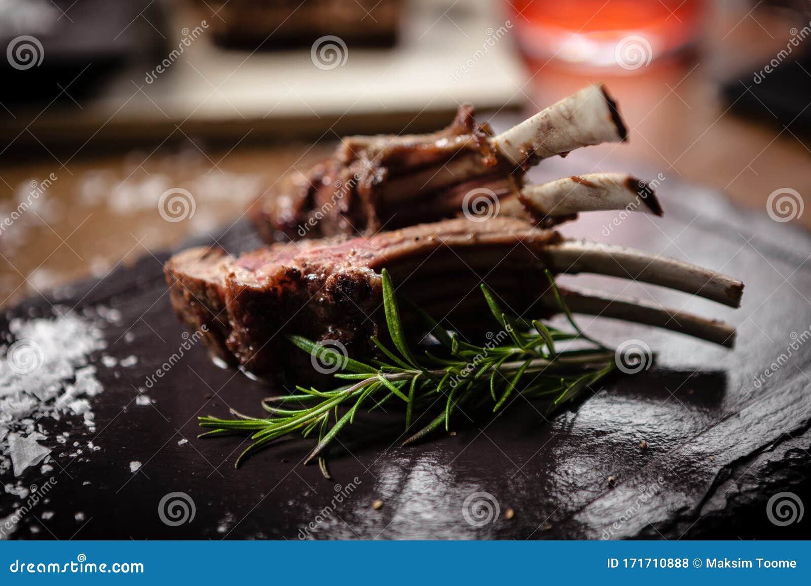 Grilled Lamb Chops Served with a Branch of Rosemary Stock Photo - Image ...
