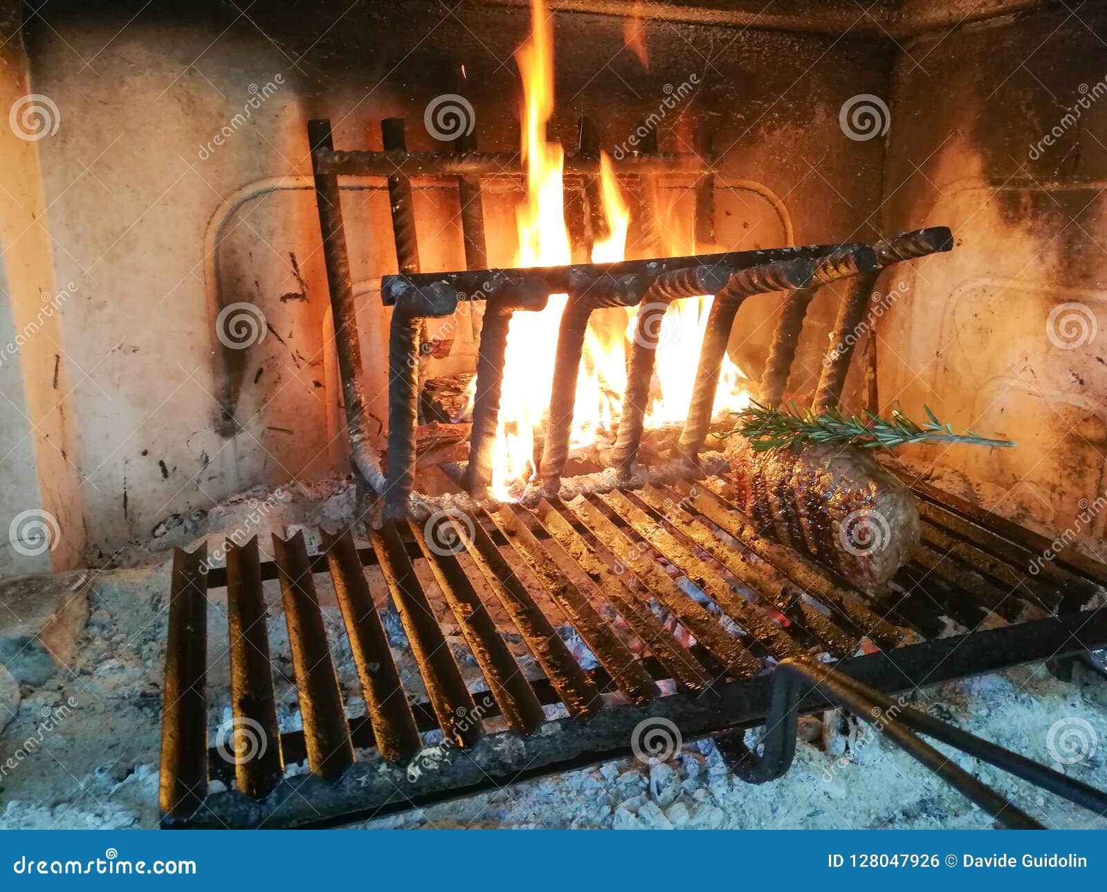 Grilled meat on fireplace stock photo. Image of food - 128047926