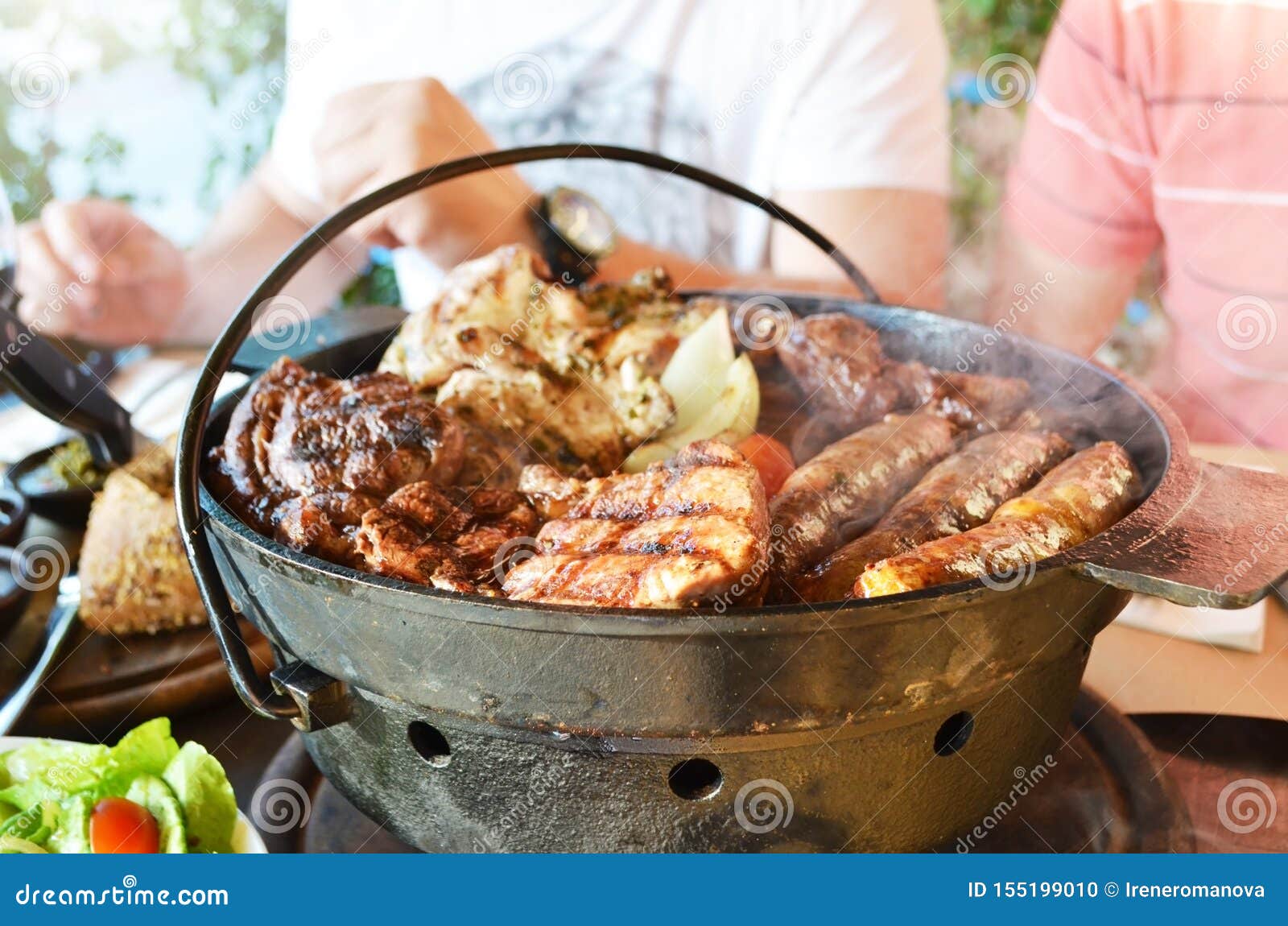 Grilled Meat. People are Eating on Vacation. Dining Concept Stock Photo ...