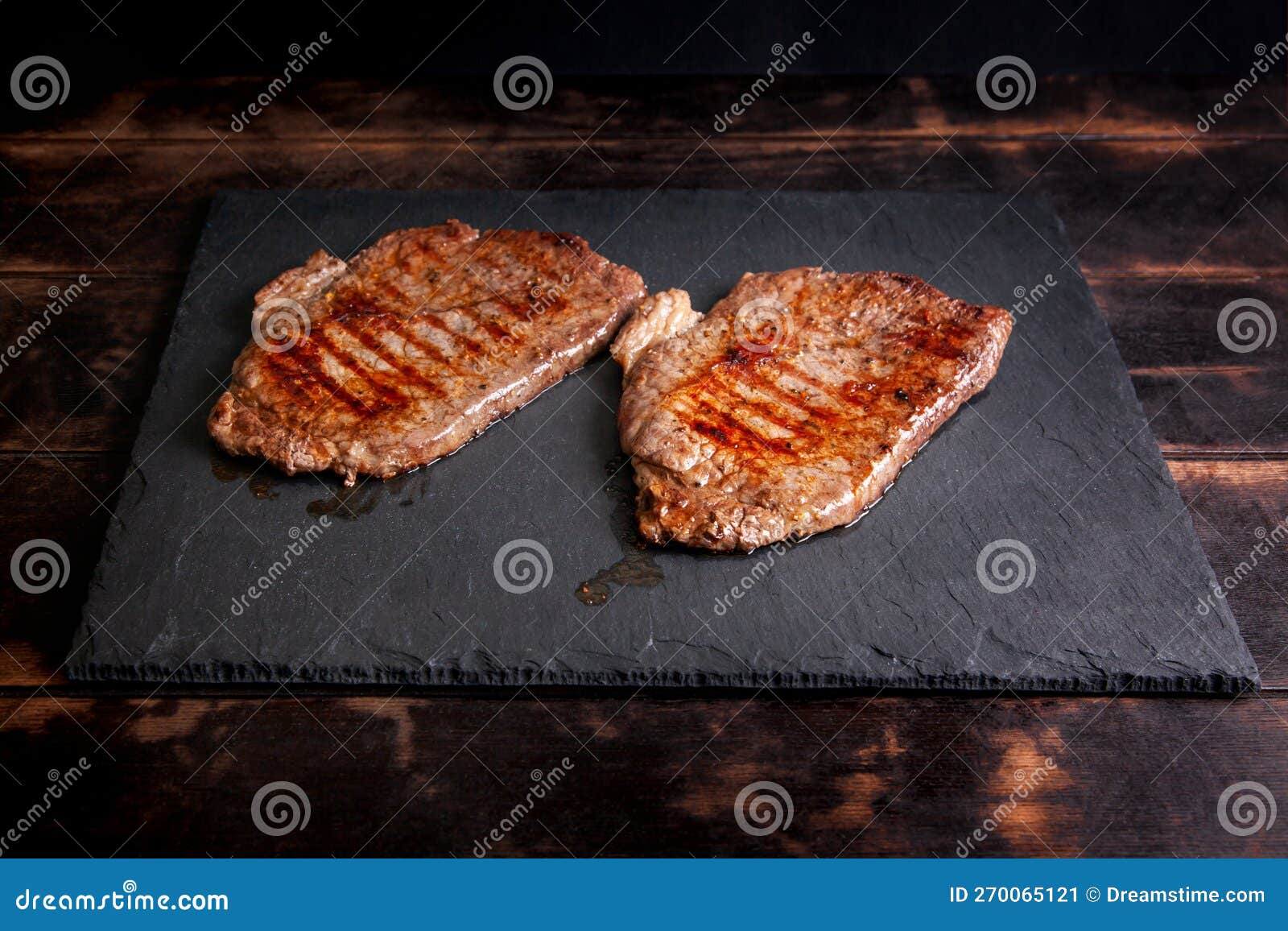 Grilled Minute Steak of Marbled Beef on a Stone Slate Board Stock Image ...