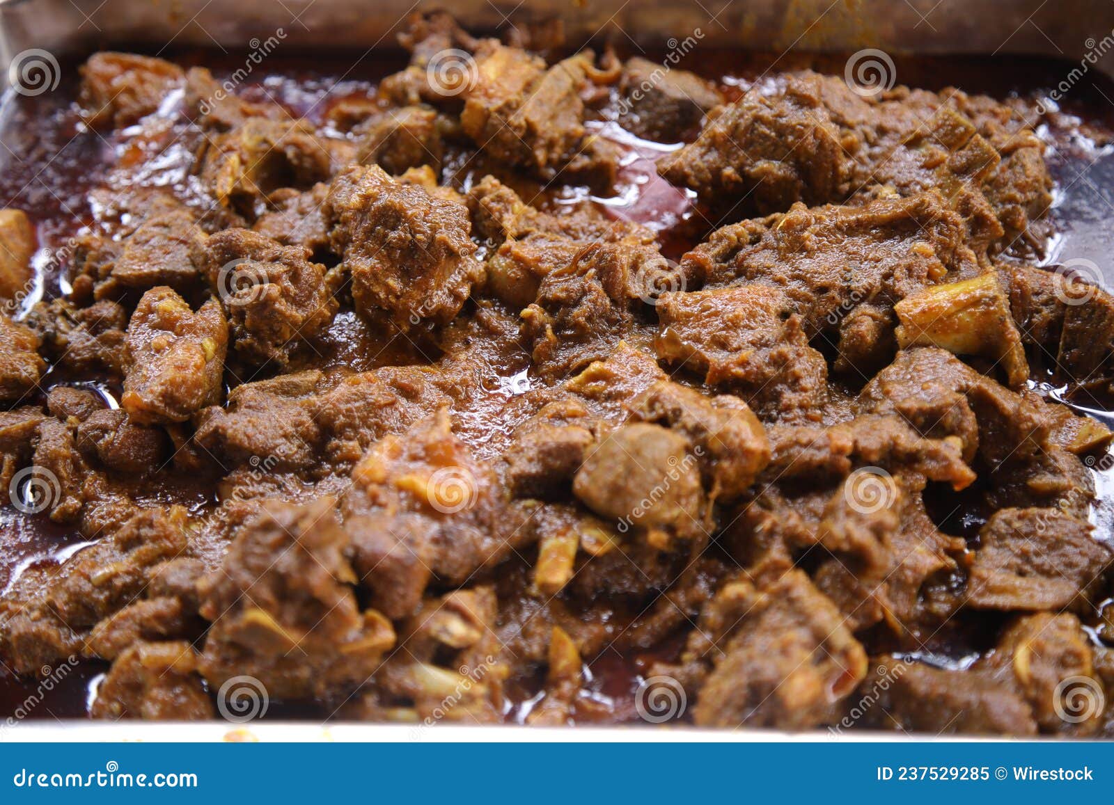 Grilled Mutton in a Serving Plate on a Wooden Table with a Black ...