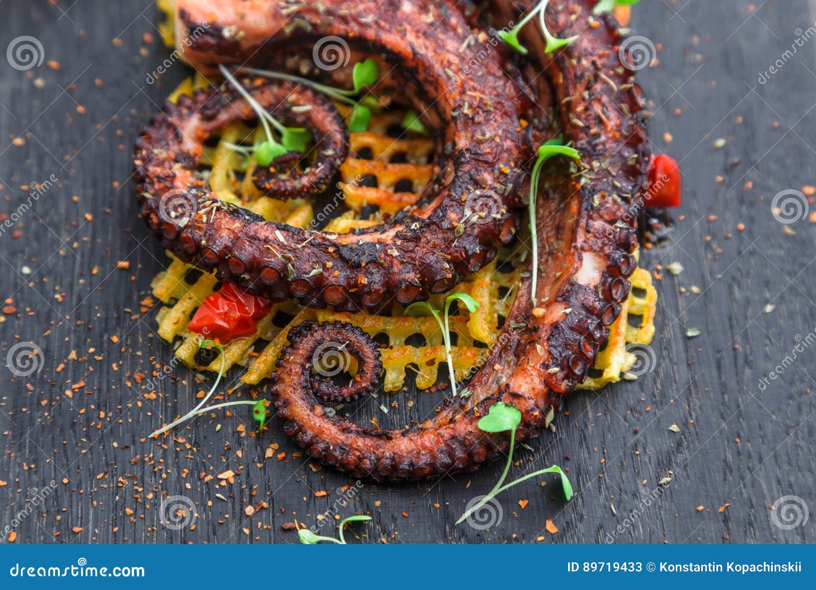 Grilled Octopus Appetizer with Small Potatoes, Close View Stock Image ...