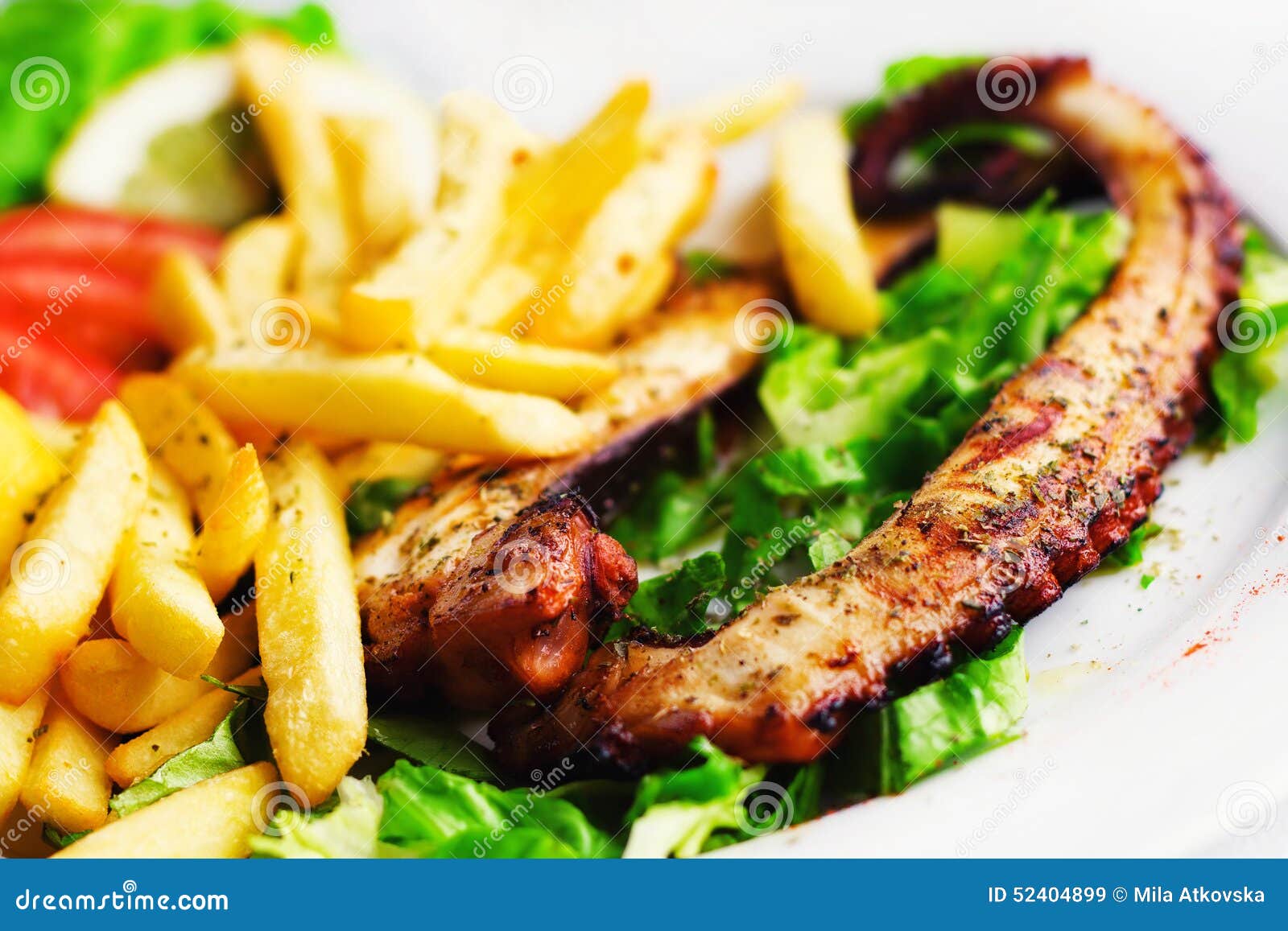 Grilled Octopus with a Side of French Fries Stock Image - Image of ...