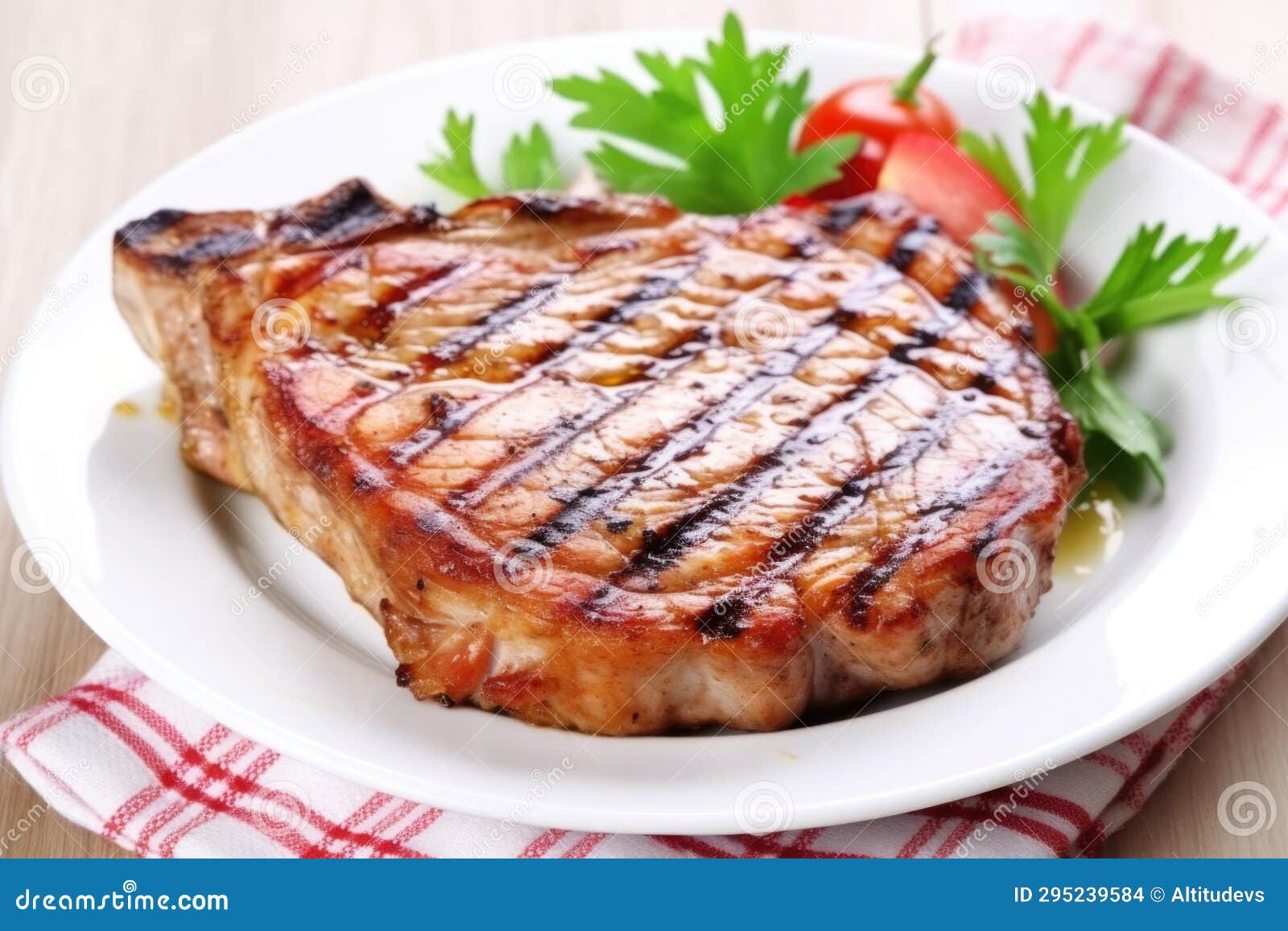 Grilled Pork Chop on a White Ceramic Plate Stock Photo - Image of ...
