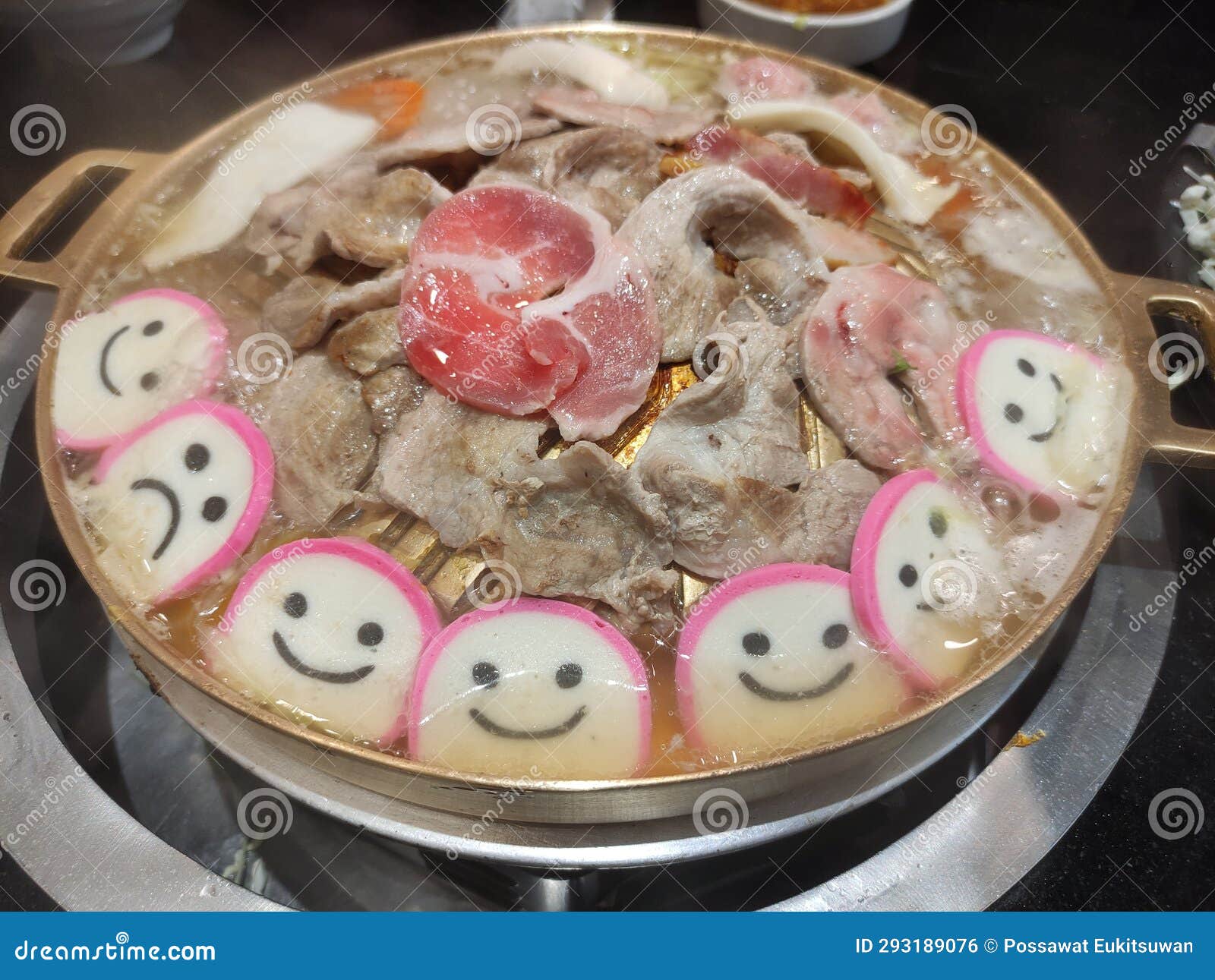Grilled Pork and Meatballs with a Smiley Face on a Brass Pan Stock ...