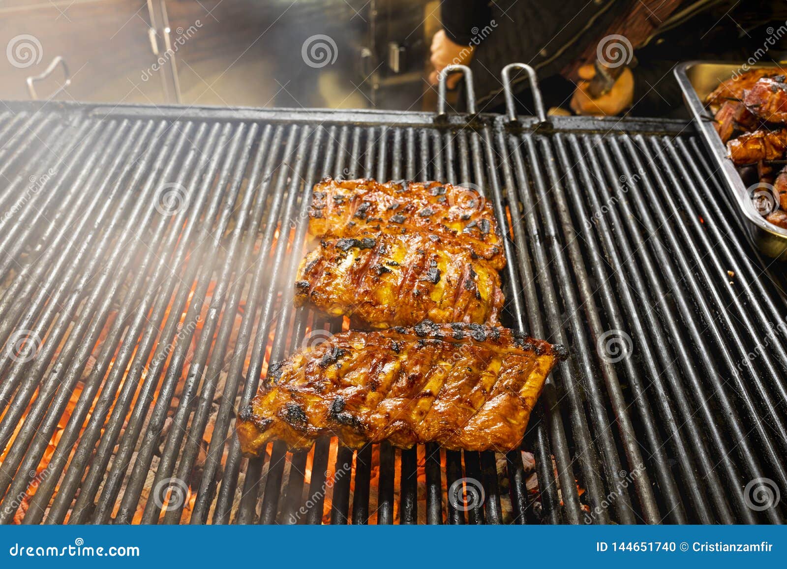 Pork ribs on the grill stock photo. Image of charcoal - 144651740