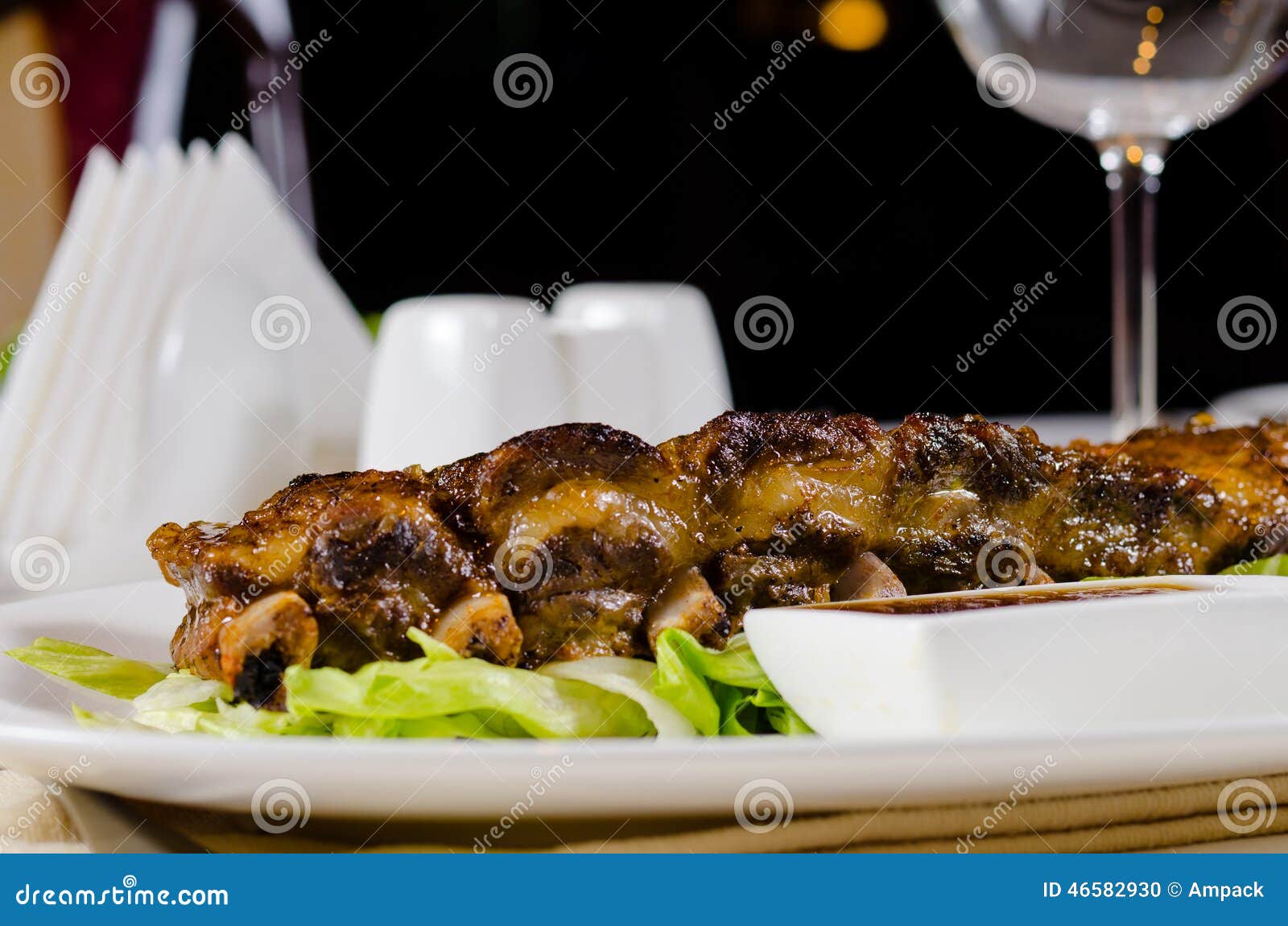 Grilled Pork Ribs on Plate in Restaurant Stock Photo - Image of meal ...