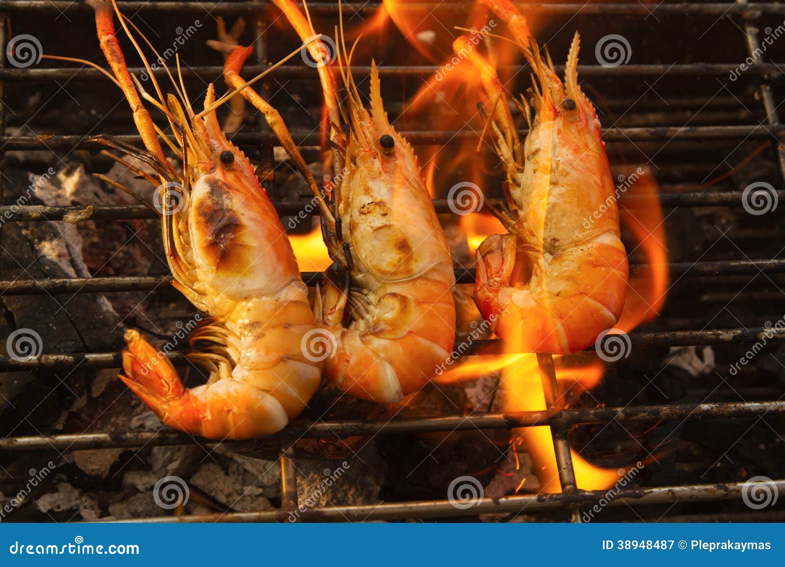 Grilled prawns on flaming stock image. Image of cooking - 38948487