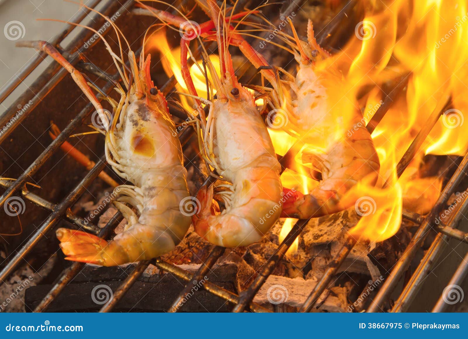 Grilled prawns on flaming stock image. Image of appetizer - 38667975