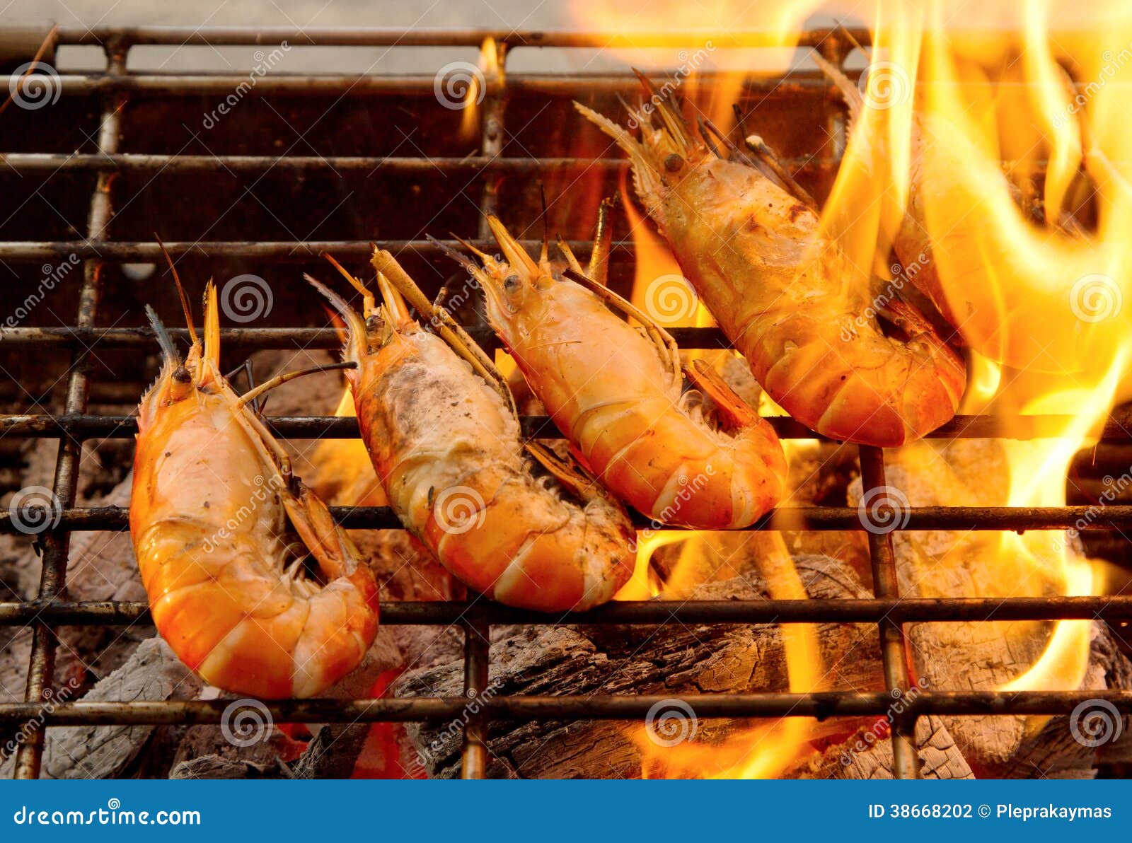 Grilled prawns on flaming stock photo. Image of flaming - 38668202