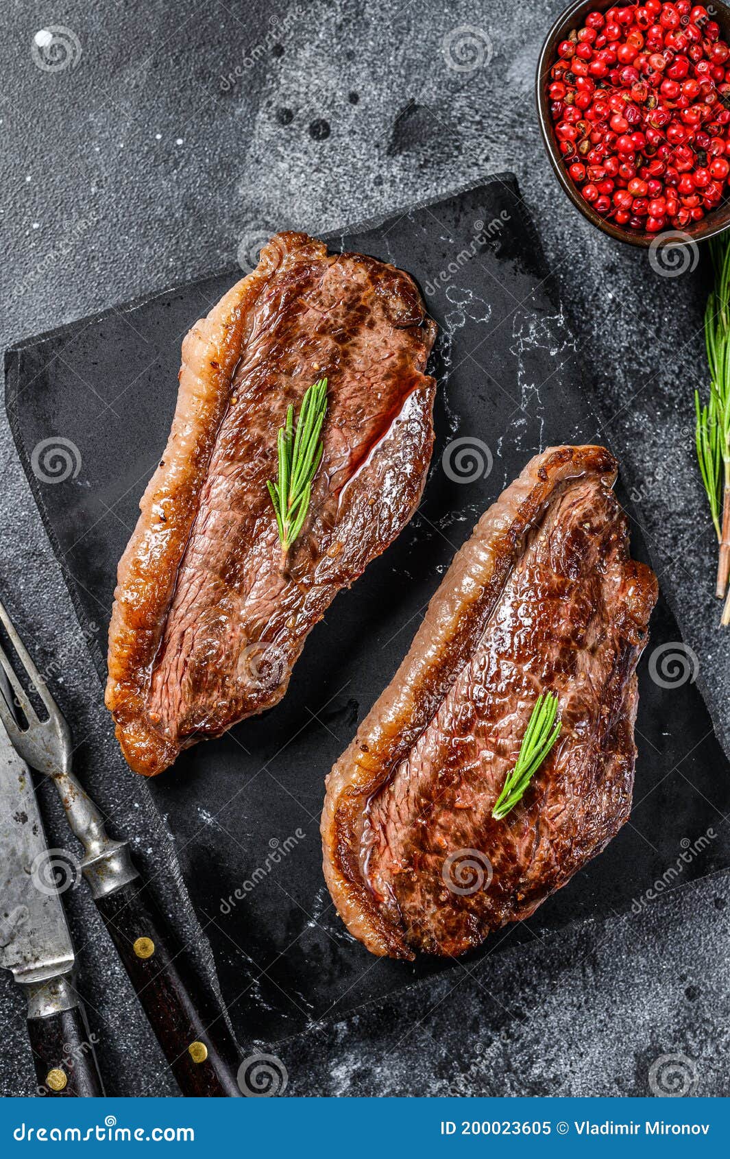 Grilled Ramp Cap Steak on a Stone Chopping Board. Black Background ...