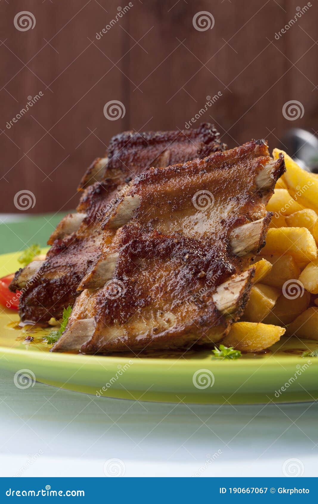 Grilled ribs on plate stock image. Image of grill, grilled - 190667067