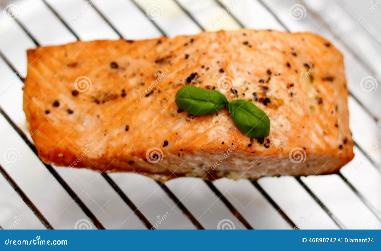 Grilled Salmon Fillet with Basil on Grill, Soft Focus Stock Photo ...