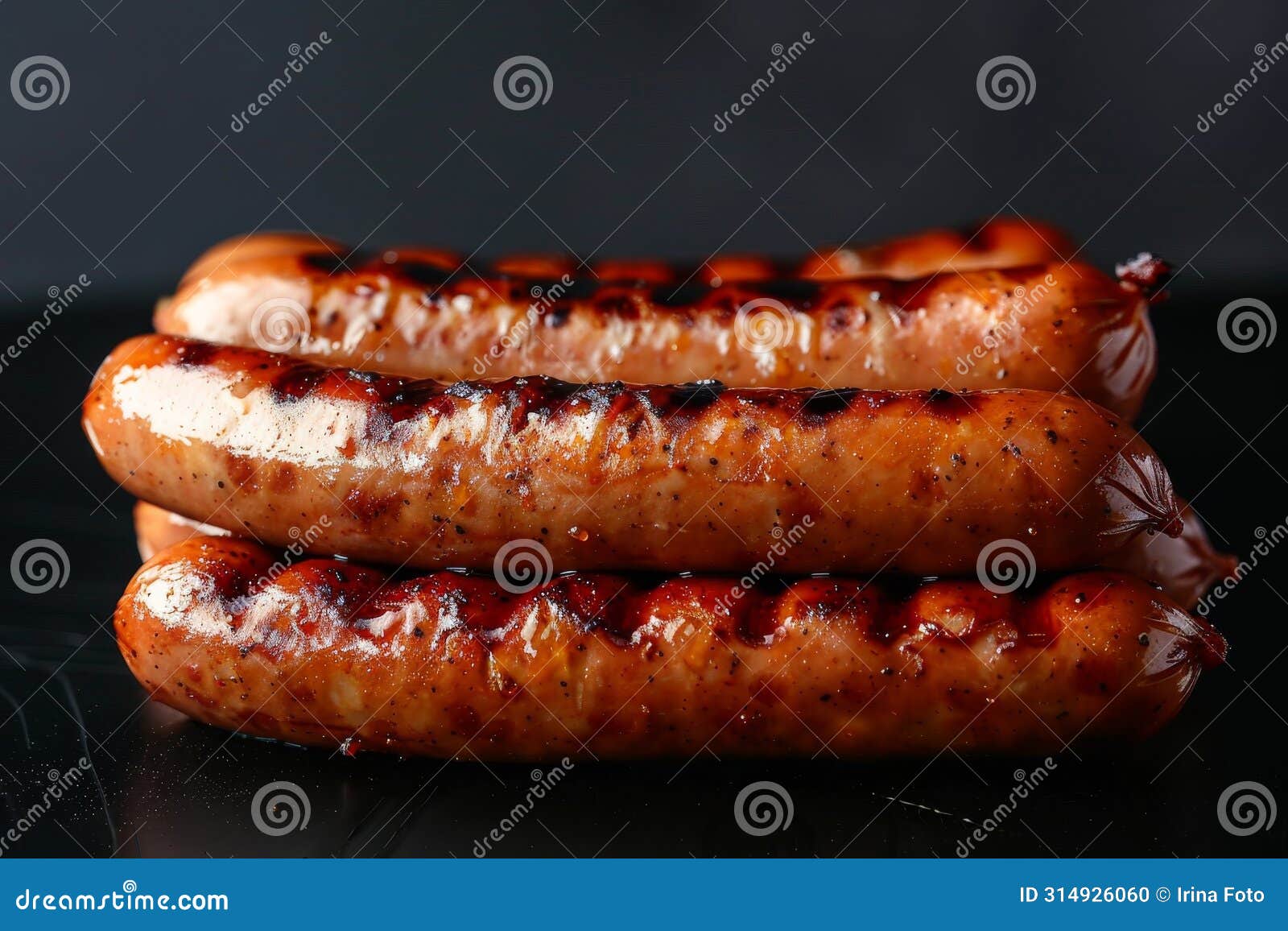 Grilled Sausages with Grill Marks on a Black Background Stock Photo ...