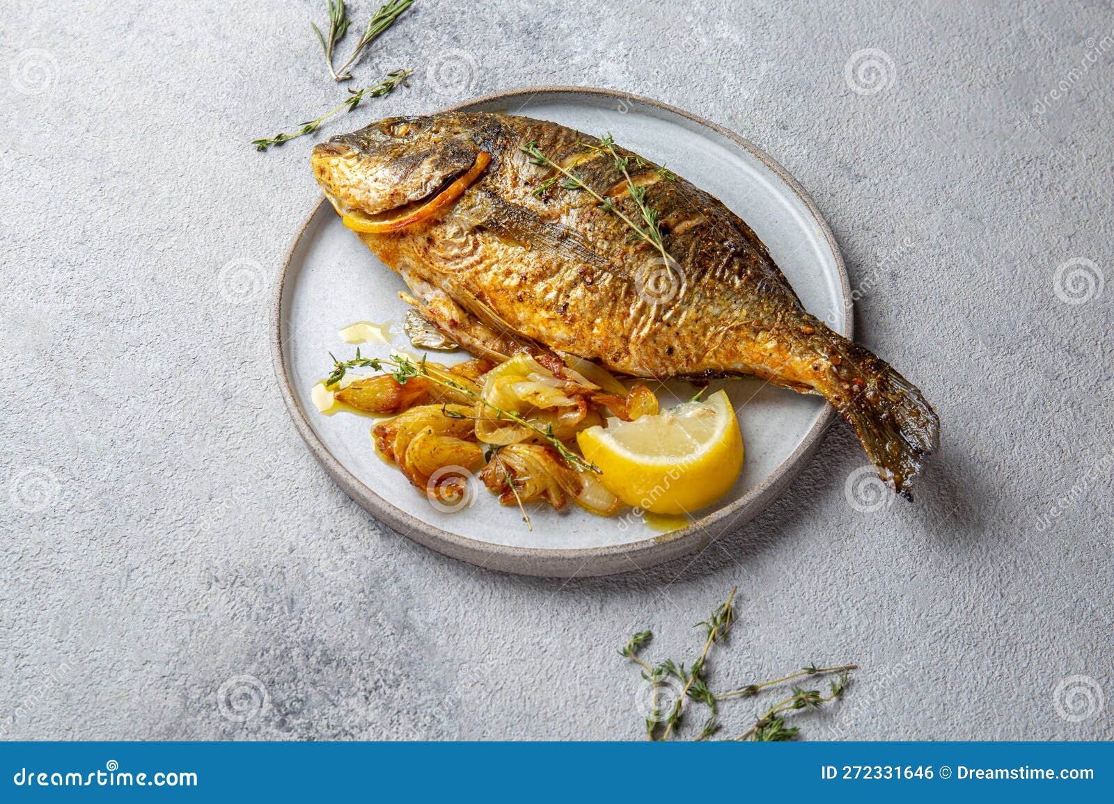 Grilled Sea Bream or Dorada on Gray Plate. Gray Background Stock Photo ...