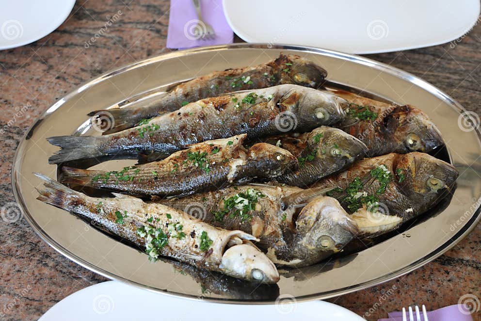 Grilled Sea Fish Stands on the Table Stock Photo - Image of traditional ...