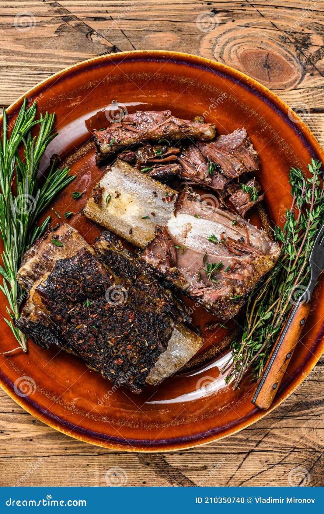 Grilled Short Beef Ribs with Thyme on a Rustic Plate. Wooden Background ...