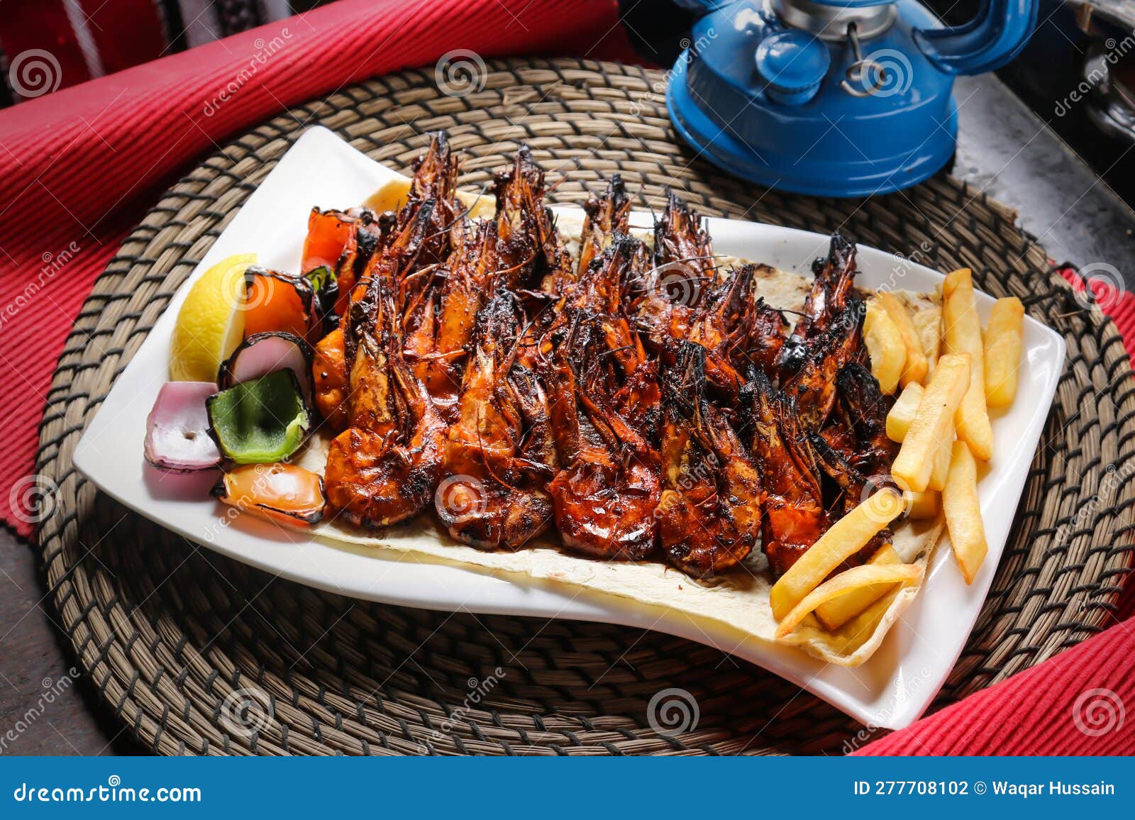 Grilled Shrimp with Fries and Salad Served in Dish Isolated on Red Mat ... Grilled Shrimp with Fries and Salad Served in Dish Isolated on Red Mat ...