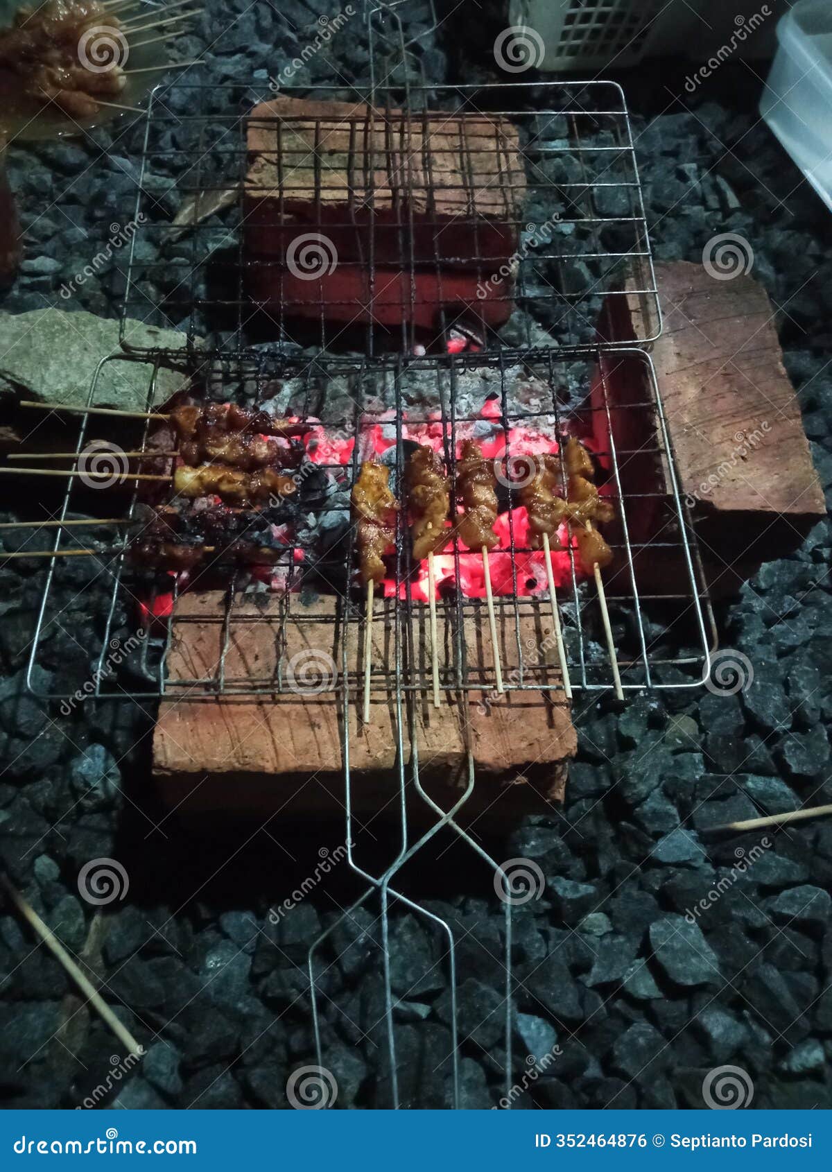 Grilled Skewered Meat Cooking Over an Open Charcoal Fire on Wire Racks ...