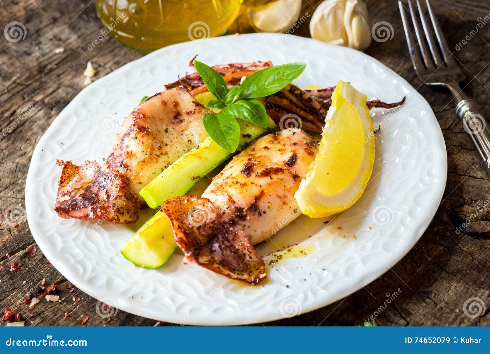 Grilled Squid With Potatoes And Spinach On A White Plate. Dish With ...