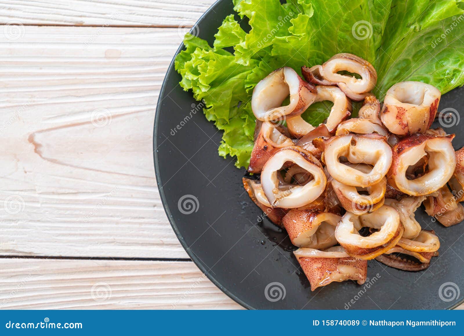Grilled squid on plate stock image. Image of delicious - 158740089