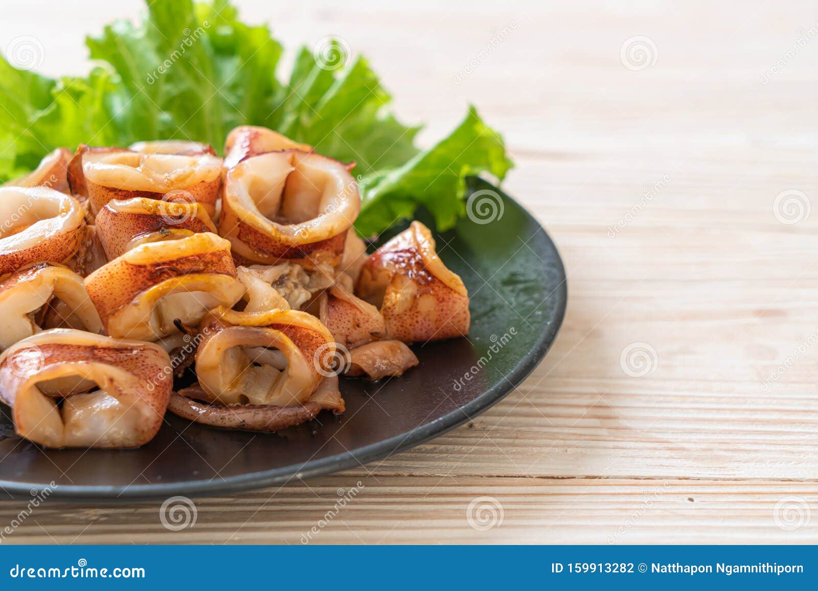 Grilled squid on plate stock photo. Image of plate, food - 159913282