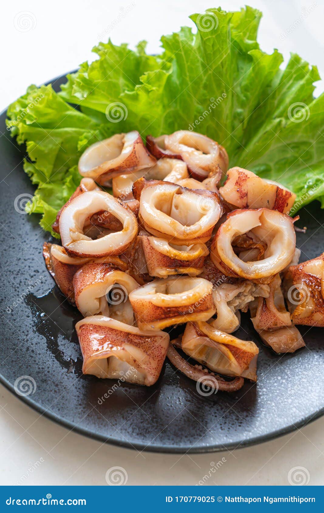 Grilled squid on plate stock image. Image of octopus - 170779025